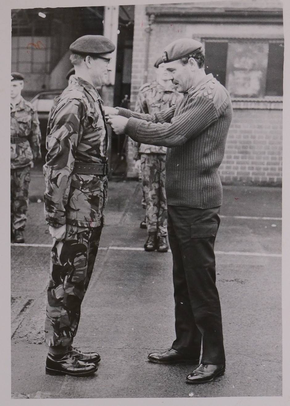 Captain David Greenfield being presented his medal by Brigadier Dick ...